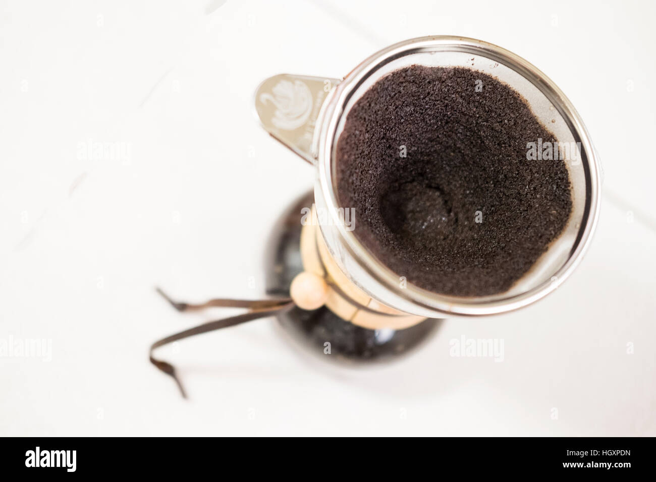 Poured over coffee vessel with coffee grounds Stock Photo - Alamy