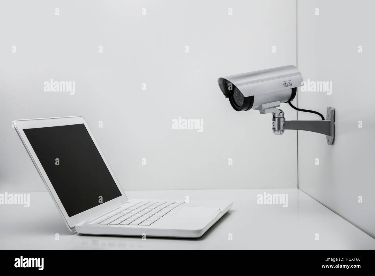 Surveillance camera and notebook computer Stock Photo - Alamy