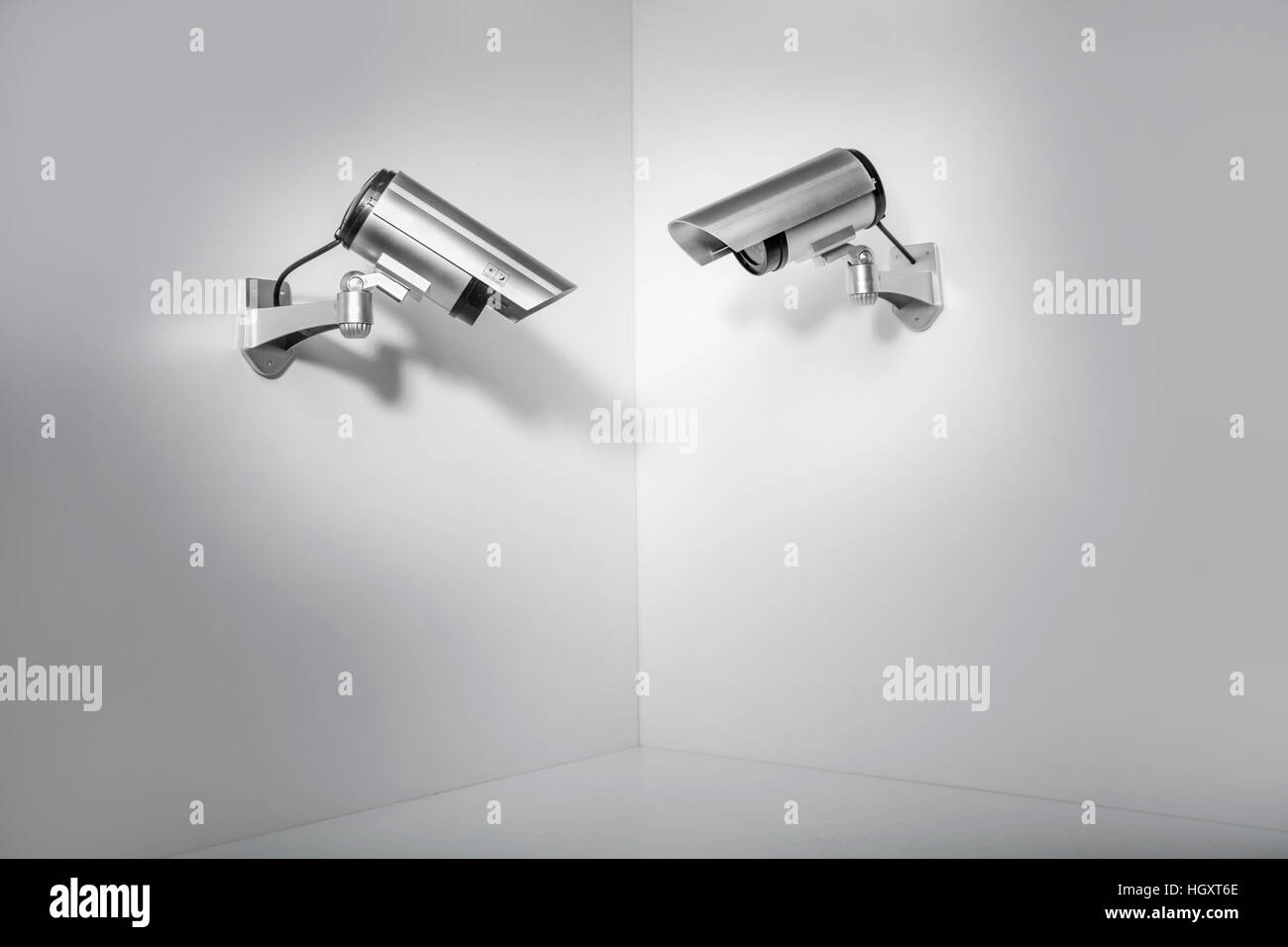 Surveillance cameras on walls Stock Photo - Alamy