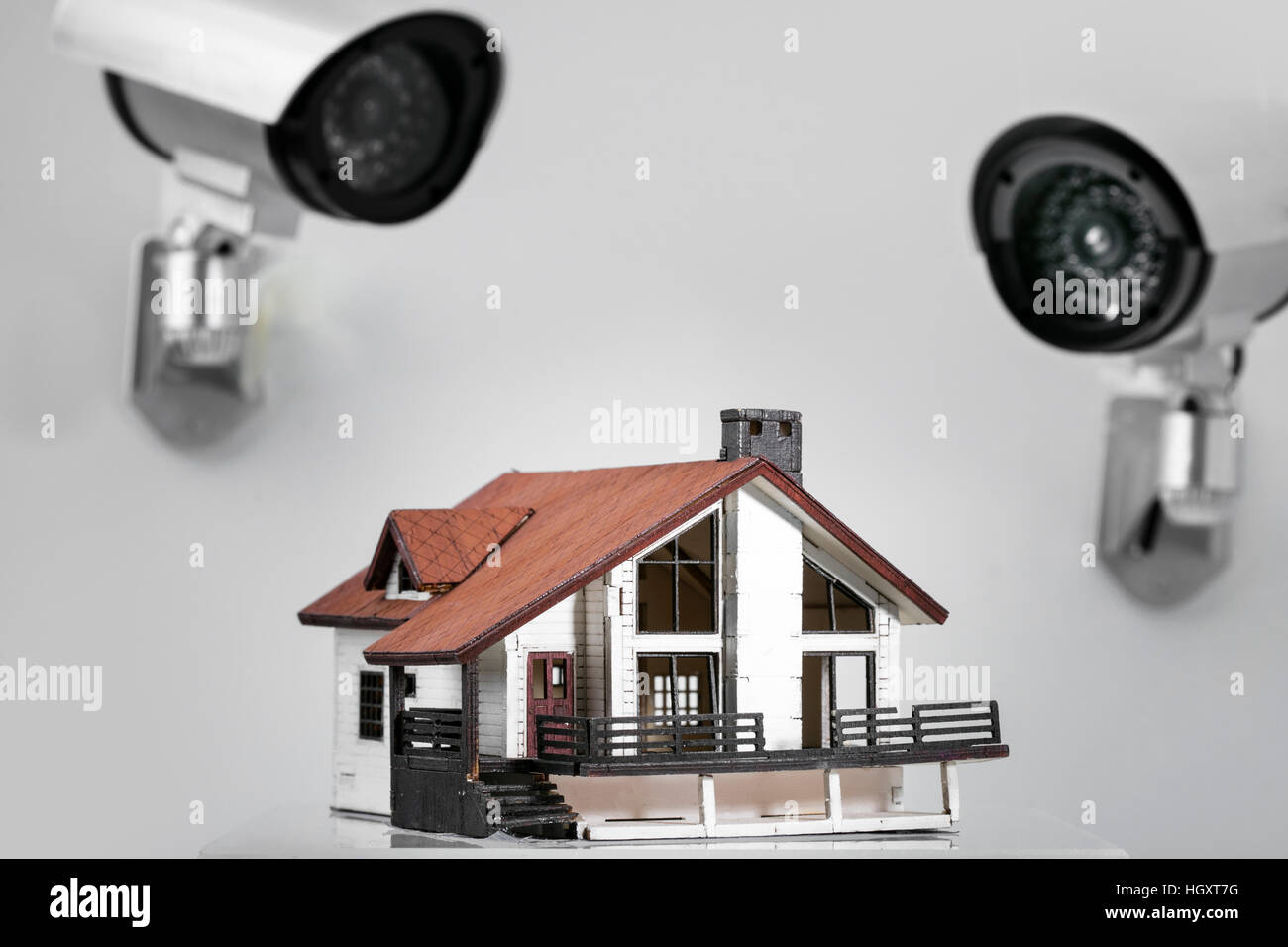 Surveillance cameras watching a house Stock Photo - Alamy