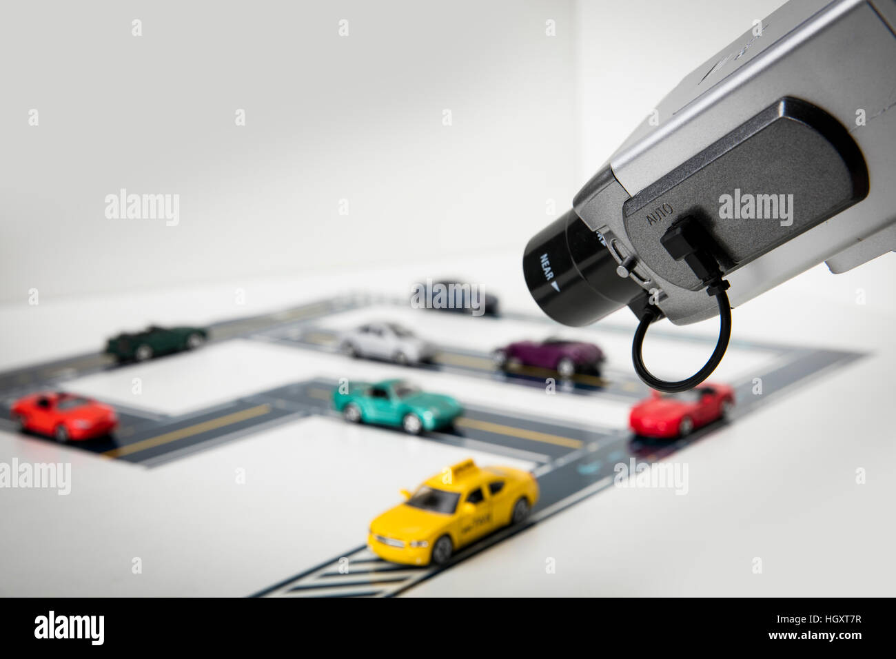 Surveillance camera watching cars on road Stock Photo - Alamy