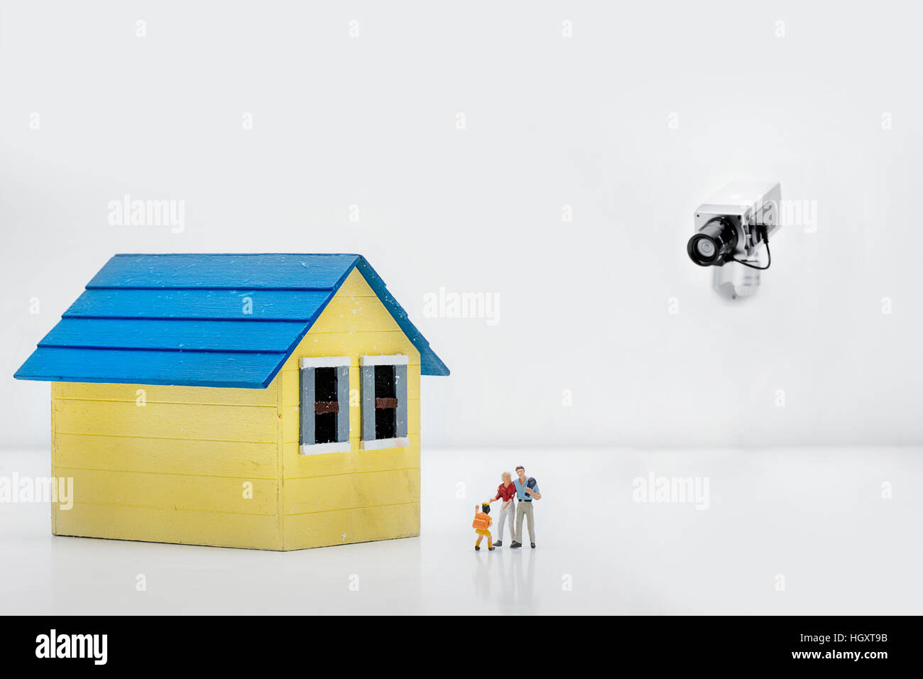 Surveillance camera watching family Stock Photo - Alamy
