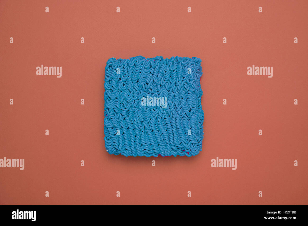 Creative blue noodles in brown Stock Photo - Alamy
