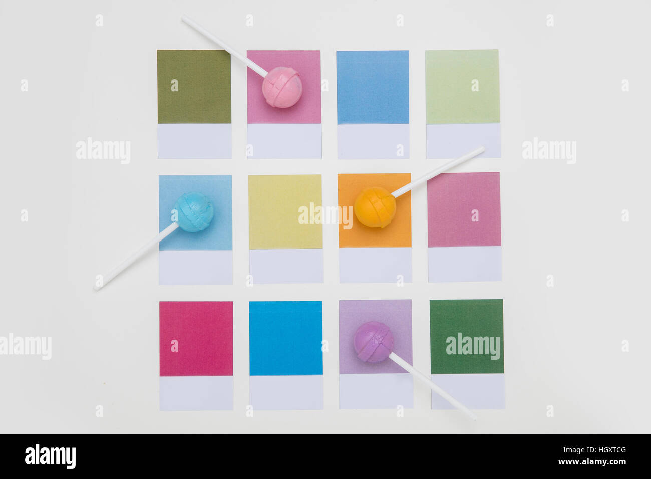 Various lollipop candies on various color codes Stock Photo - Alamy