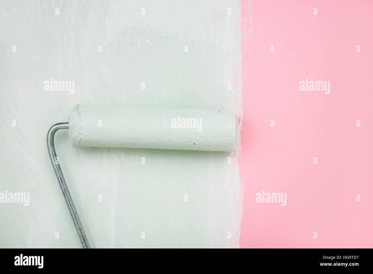 Paintroller against pink Stock Photo - Alamy