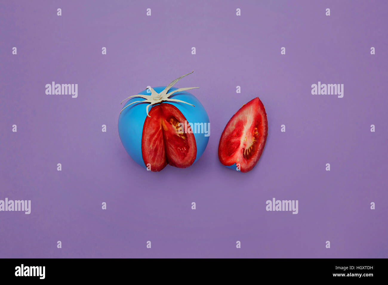 Cross section of creative blue tomato Stock Photo - Alamy