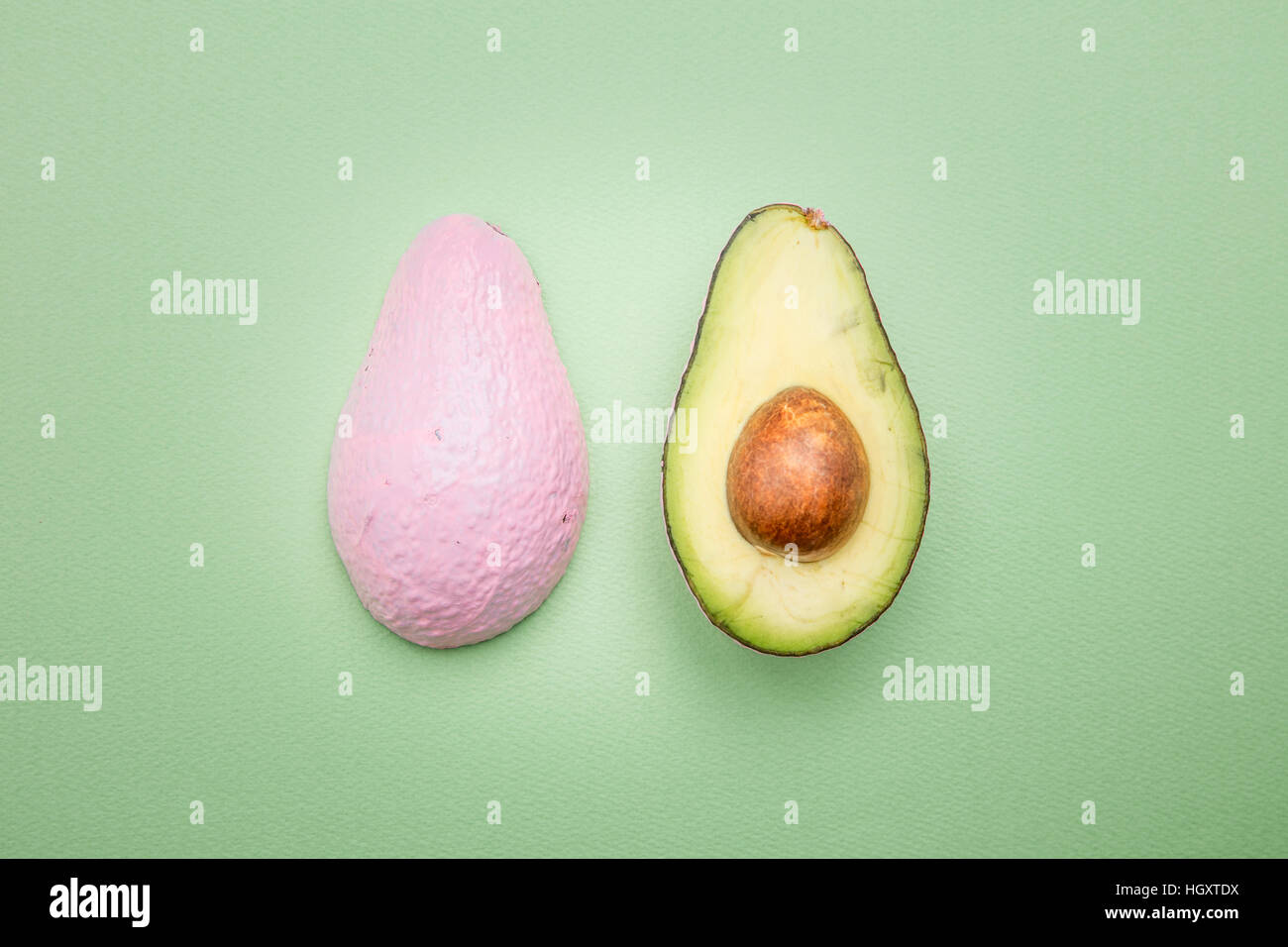 Cross sections of creative pink avocado Stock Photo - Alamy