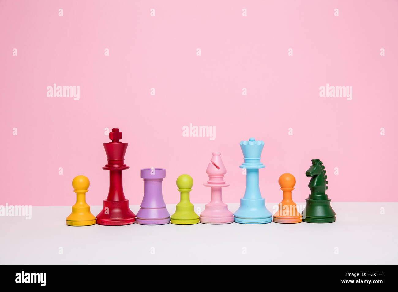 Colorful chess markers in a row Stock Photo - Alamy