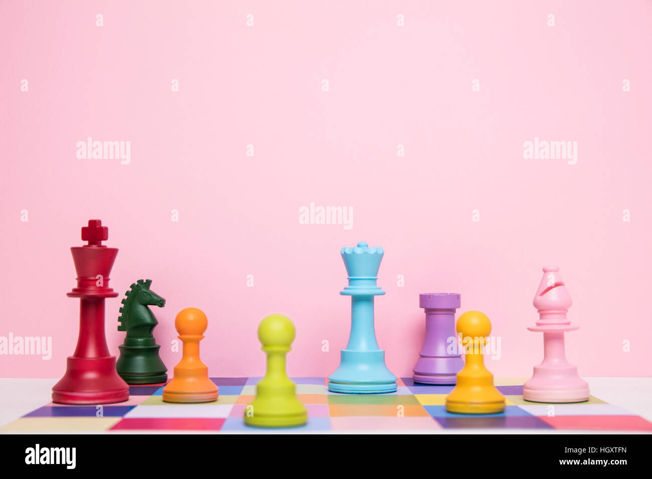 Colorful chess markers on chessboard Stock Photo - Alamy