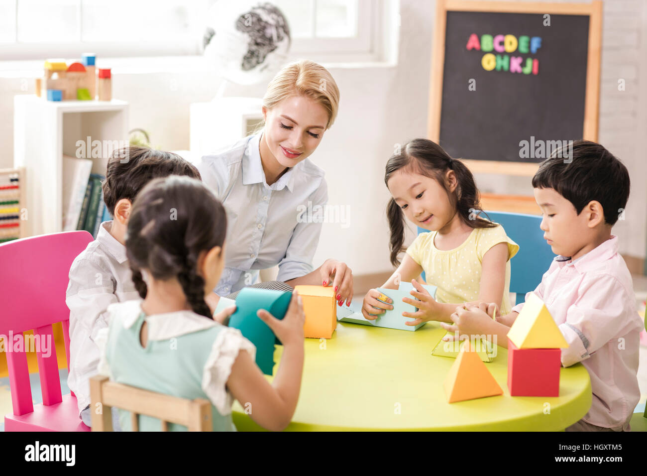 Children as teacher hi-res stock photography and images - Alamy