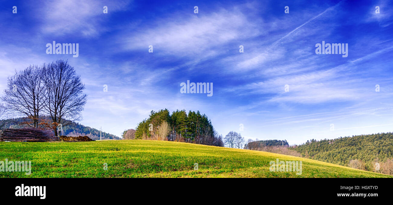 Peaceful rural landscape with hills, forest and trees Stock Photo - Alamy
