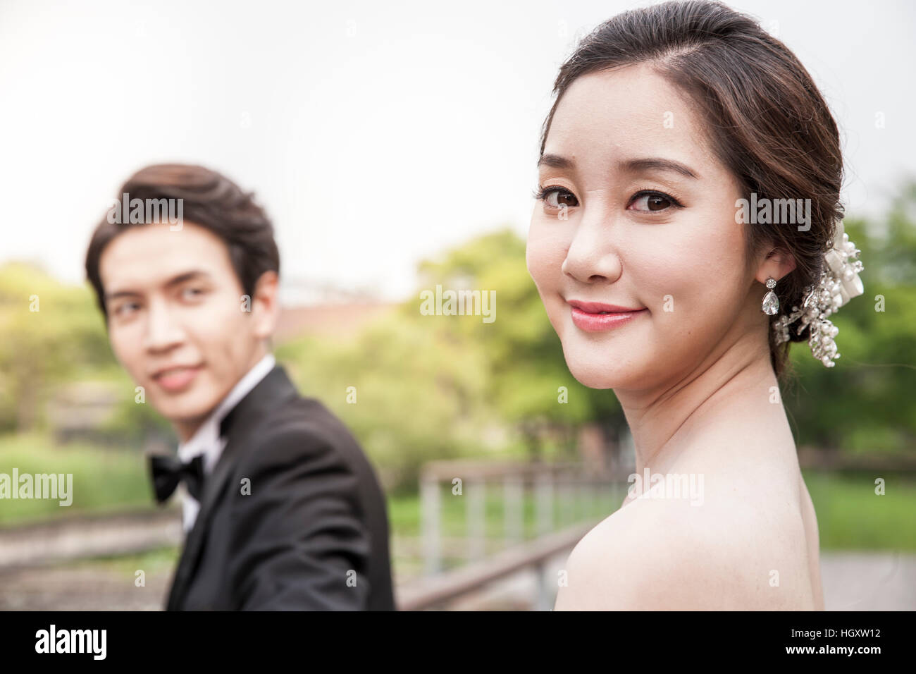 Smiling bride with groom Stock Photo - Alamy