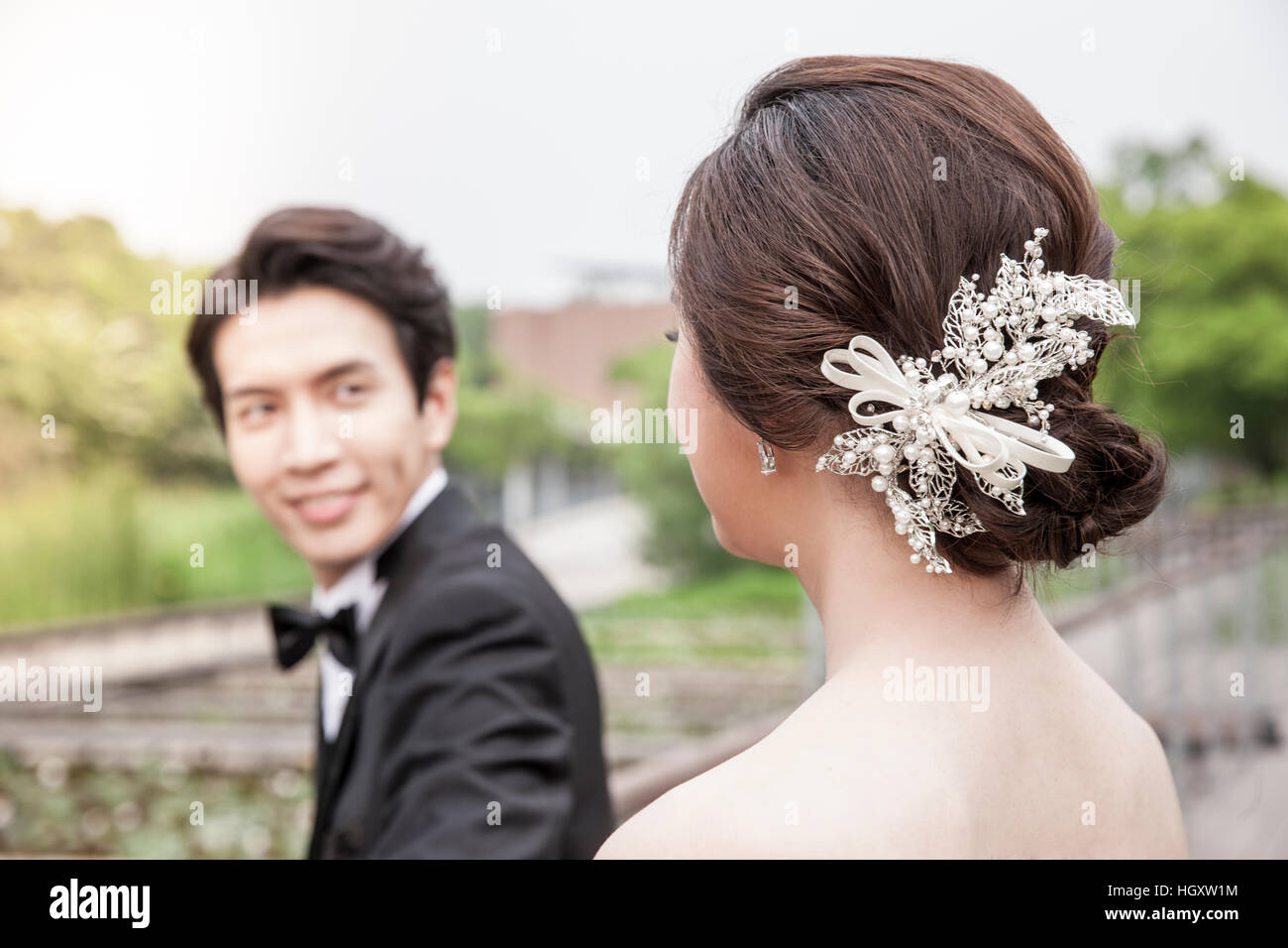 Smiling groom and his bride Stock Photo - Alamy