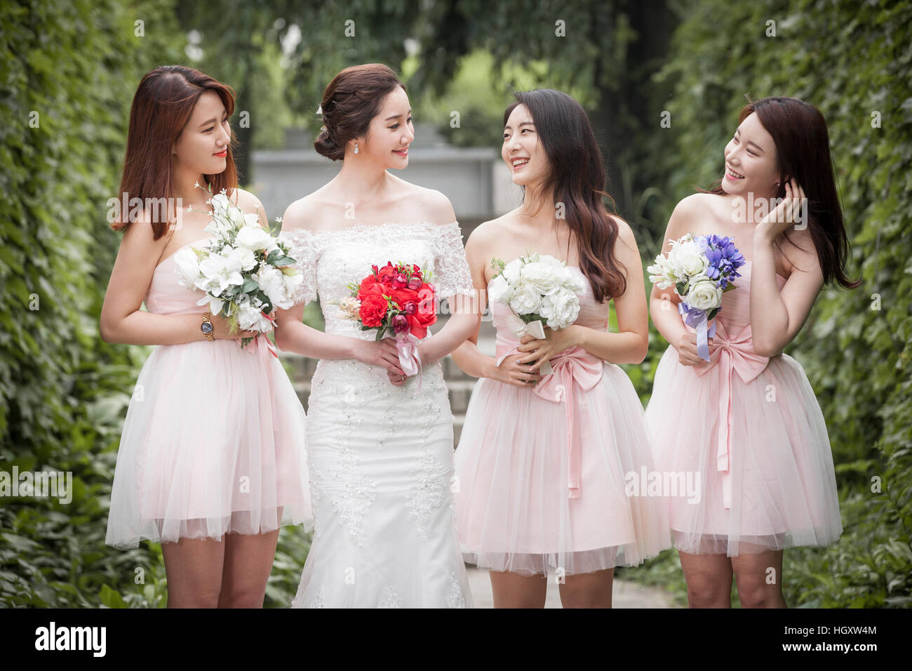Smiling bride and her friends Stock Photo - Alamy