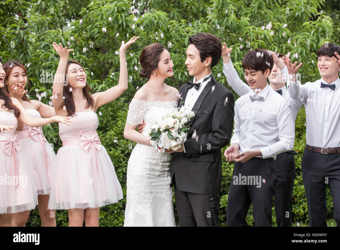 Smiling wedding couple and their friends Stock Photo - Alamy
