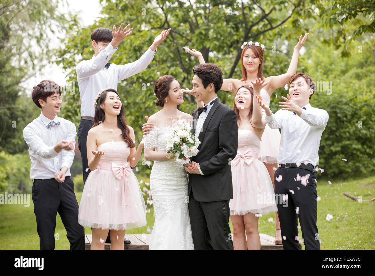 Romantic wedding couple and their friends Stock Photo - Alamy