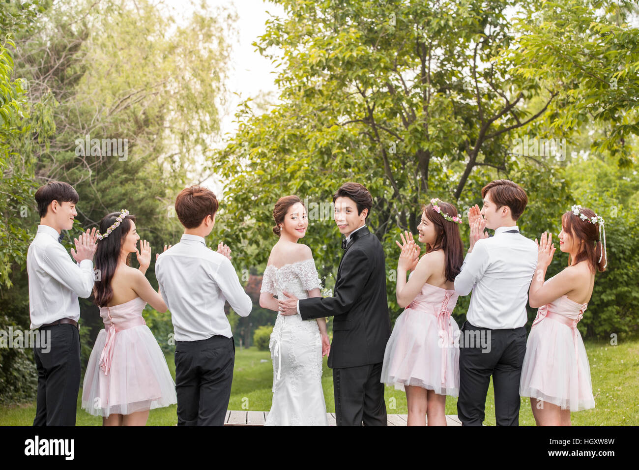 Romantic wedding couple and their friends Stock Photo - Alamy