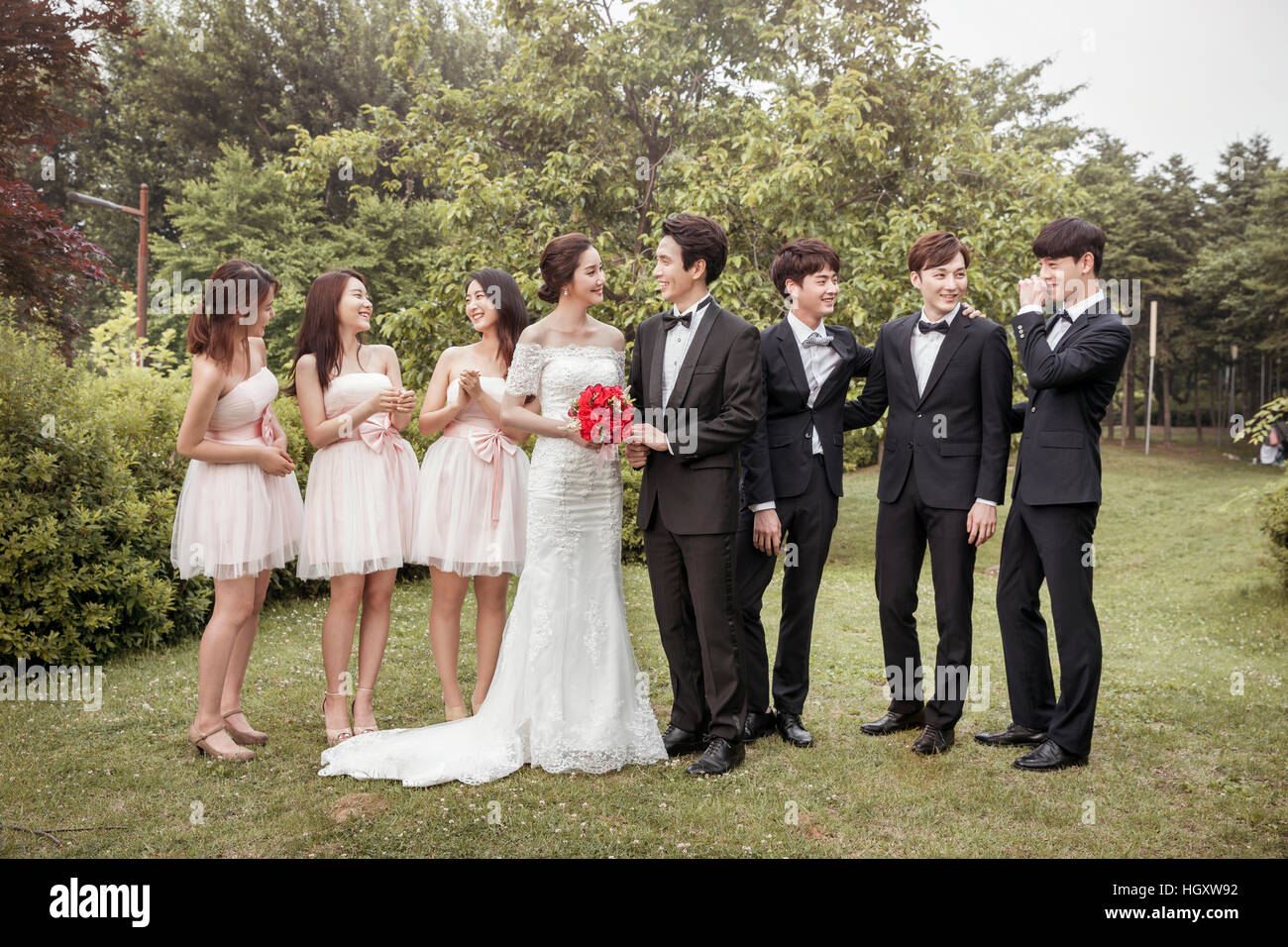 Romantic wedding couple and their friends Stock Photo - Alamy