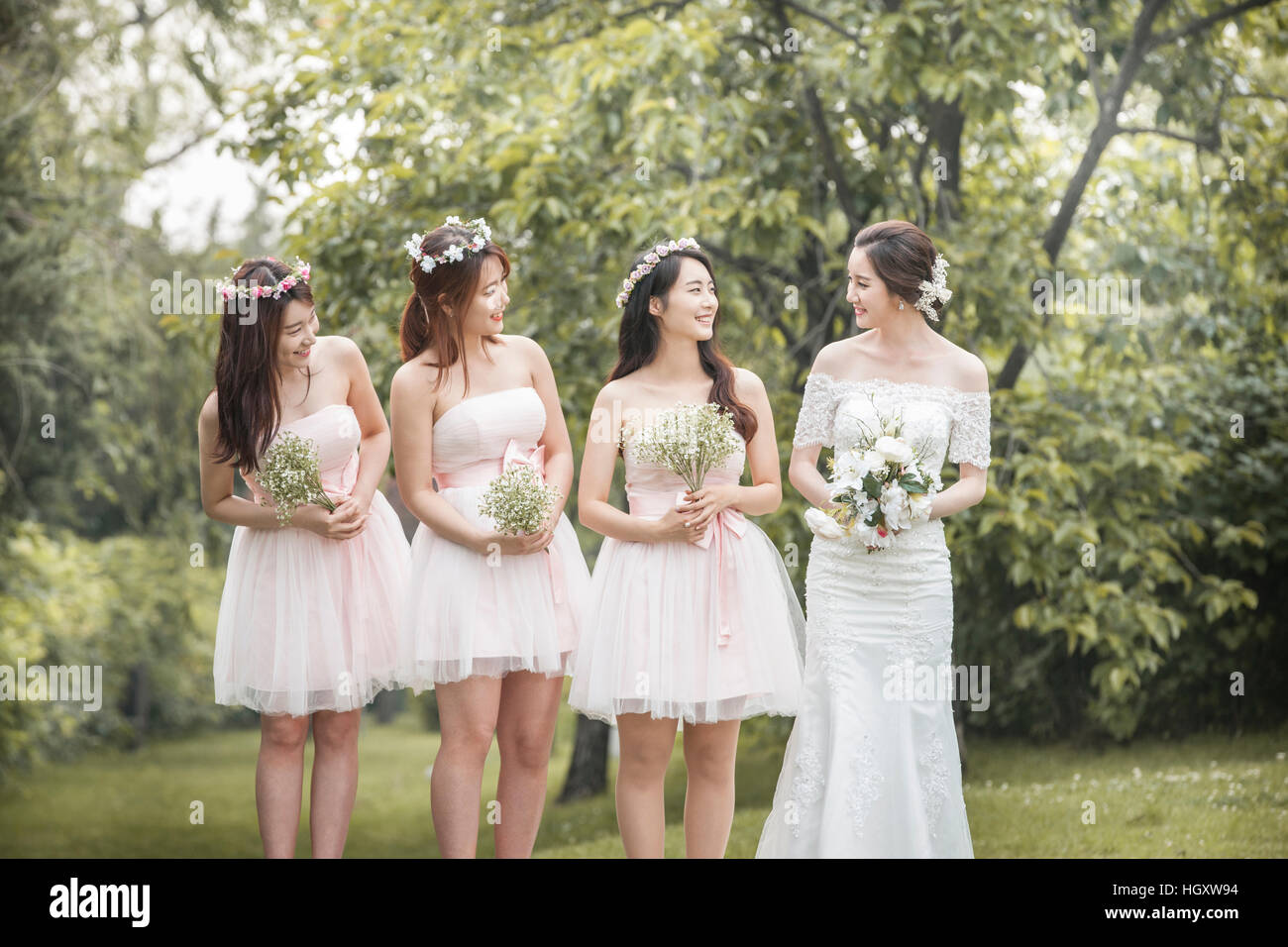 Smiling bride and her friends Stock Photo - Alamy