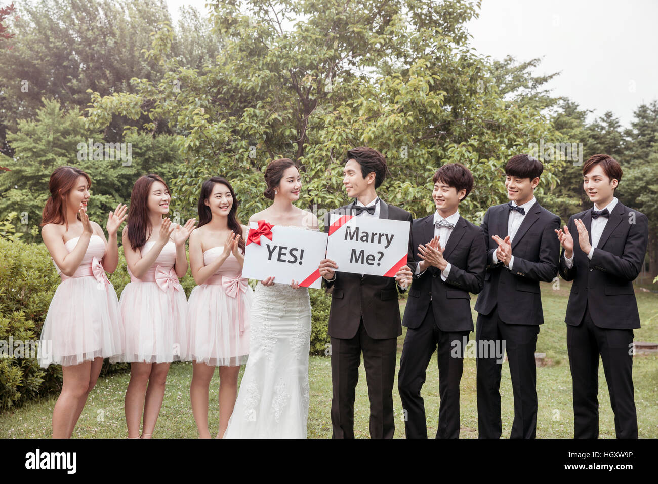 Romantic wedding couple and their friends Stock Photo - Alamy