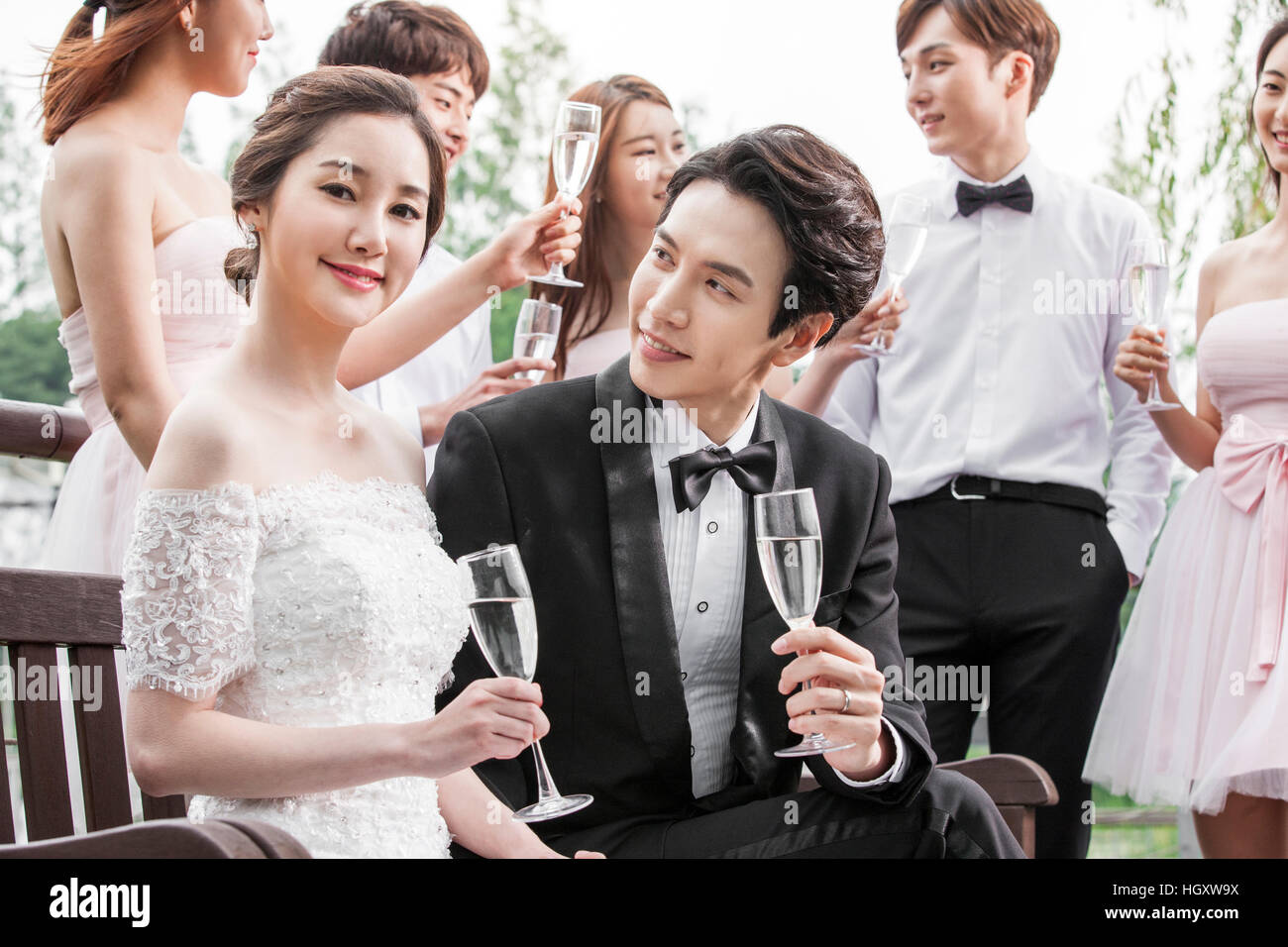Romantic wedding.couple and their friends Stock Photo - Alamy