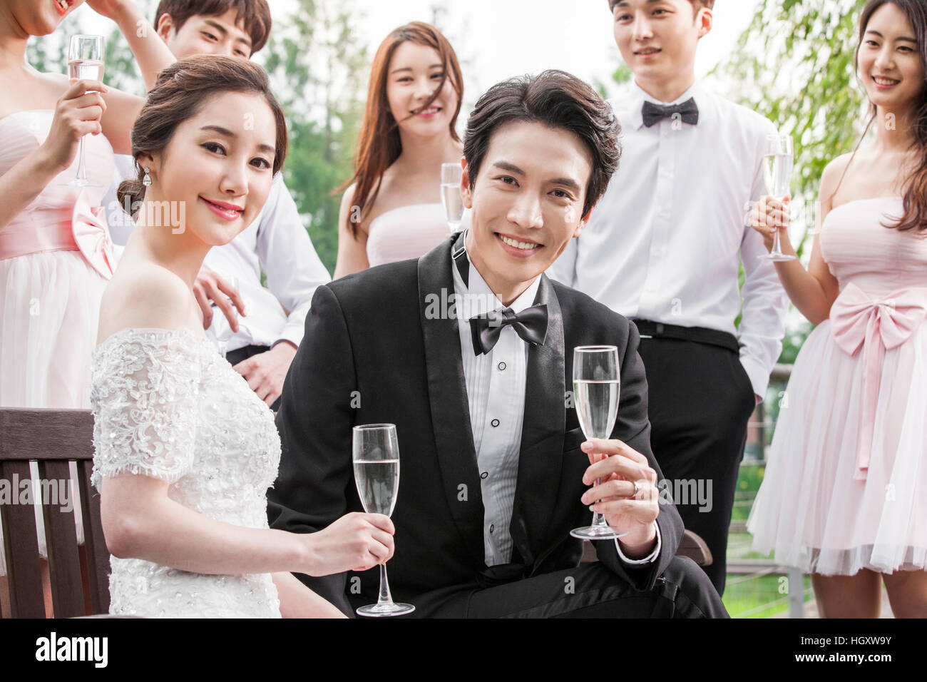 Romantic wedding couple and their friends Stock Photo - Alamy