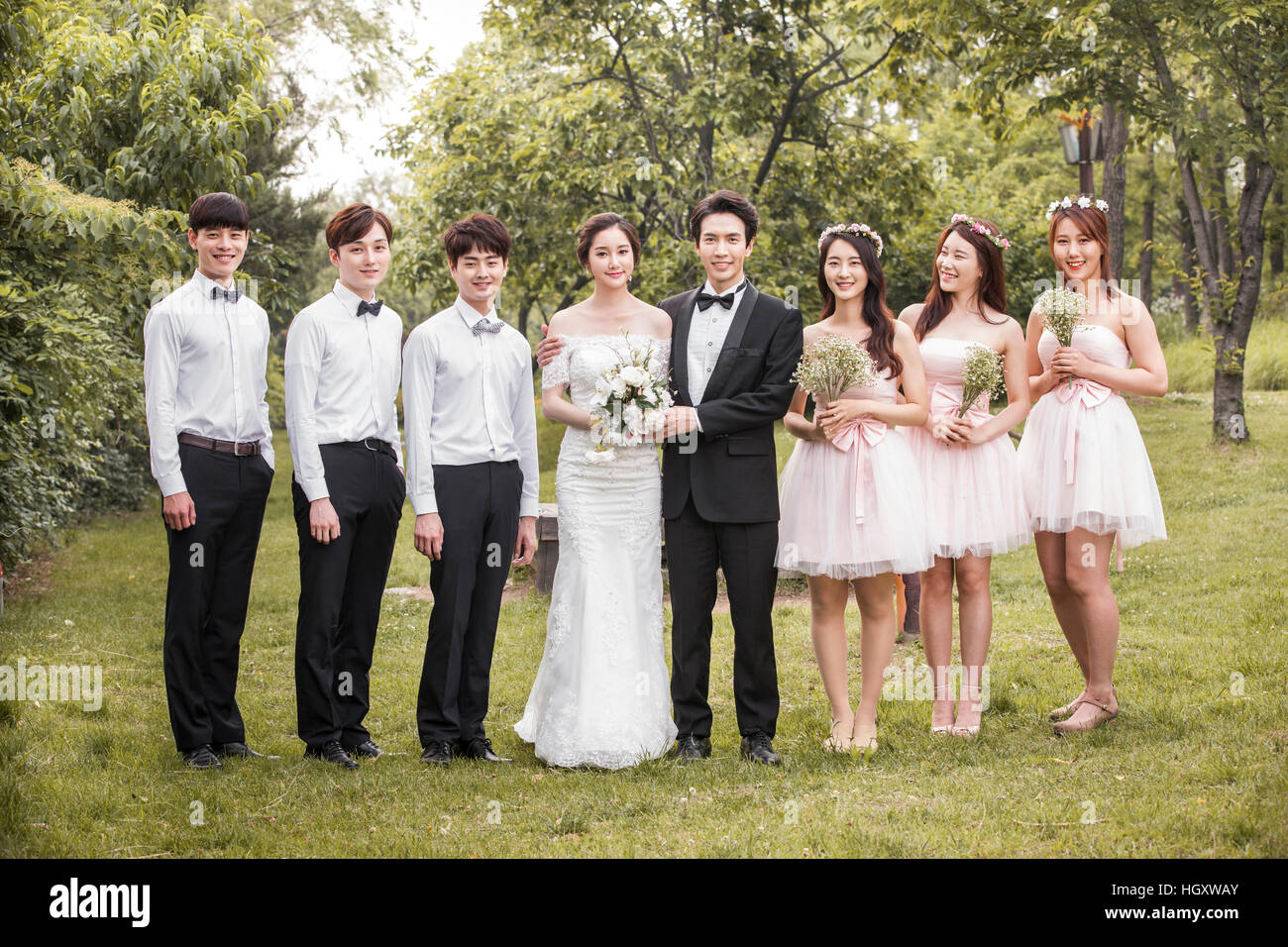 Romantic wedding couple and their friends Stock Photo - Alamy