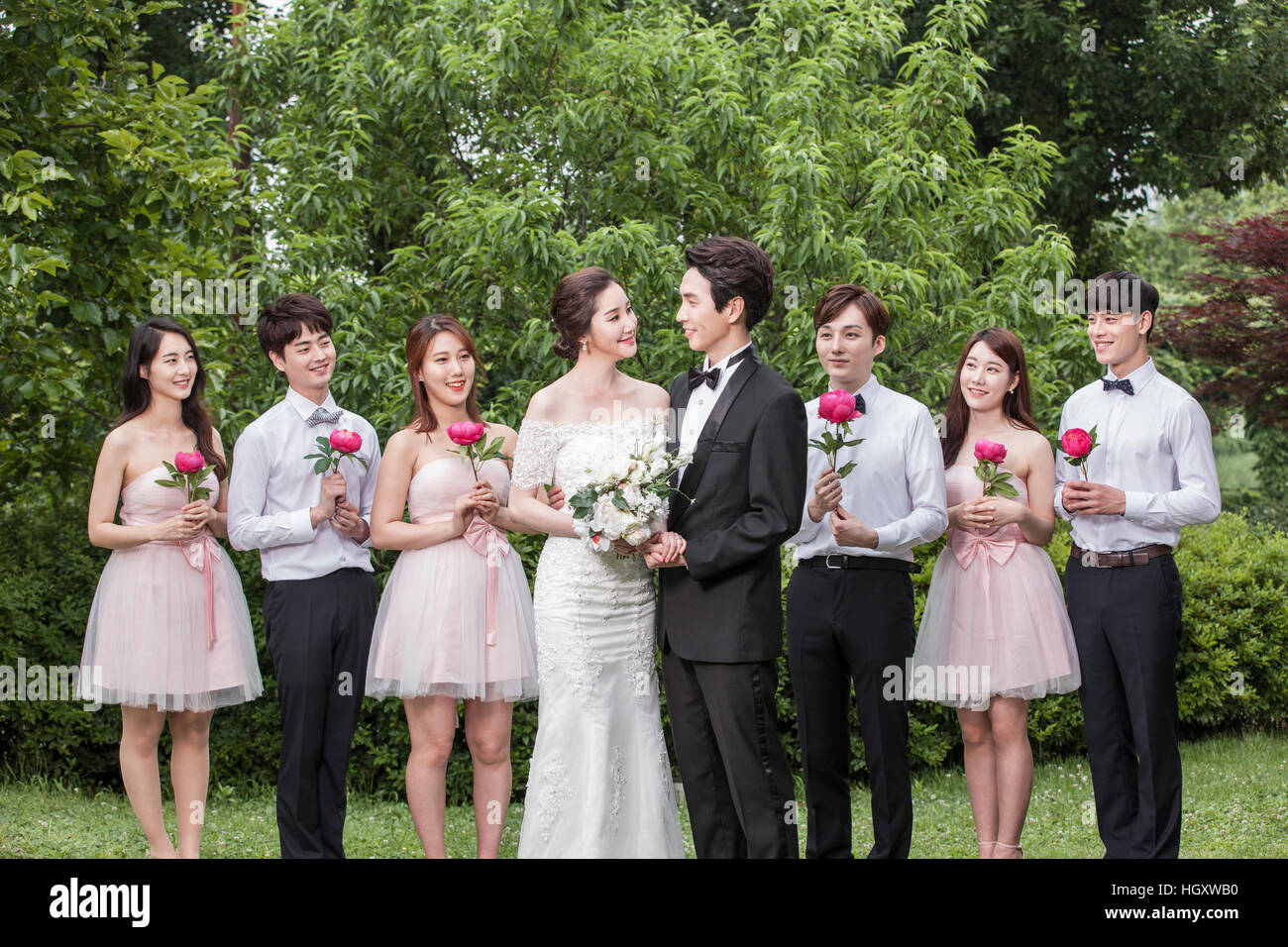 Romantic wedding couple and their friends Stock Photo - Alamy