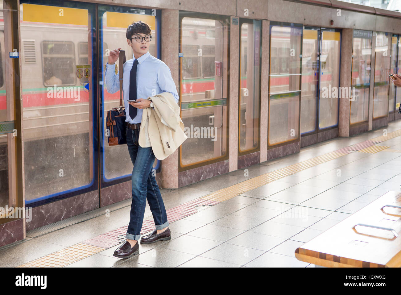 Businessman walking at subway station Stock Photo - Alamy