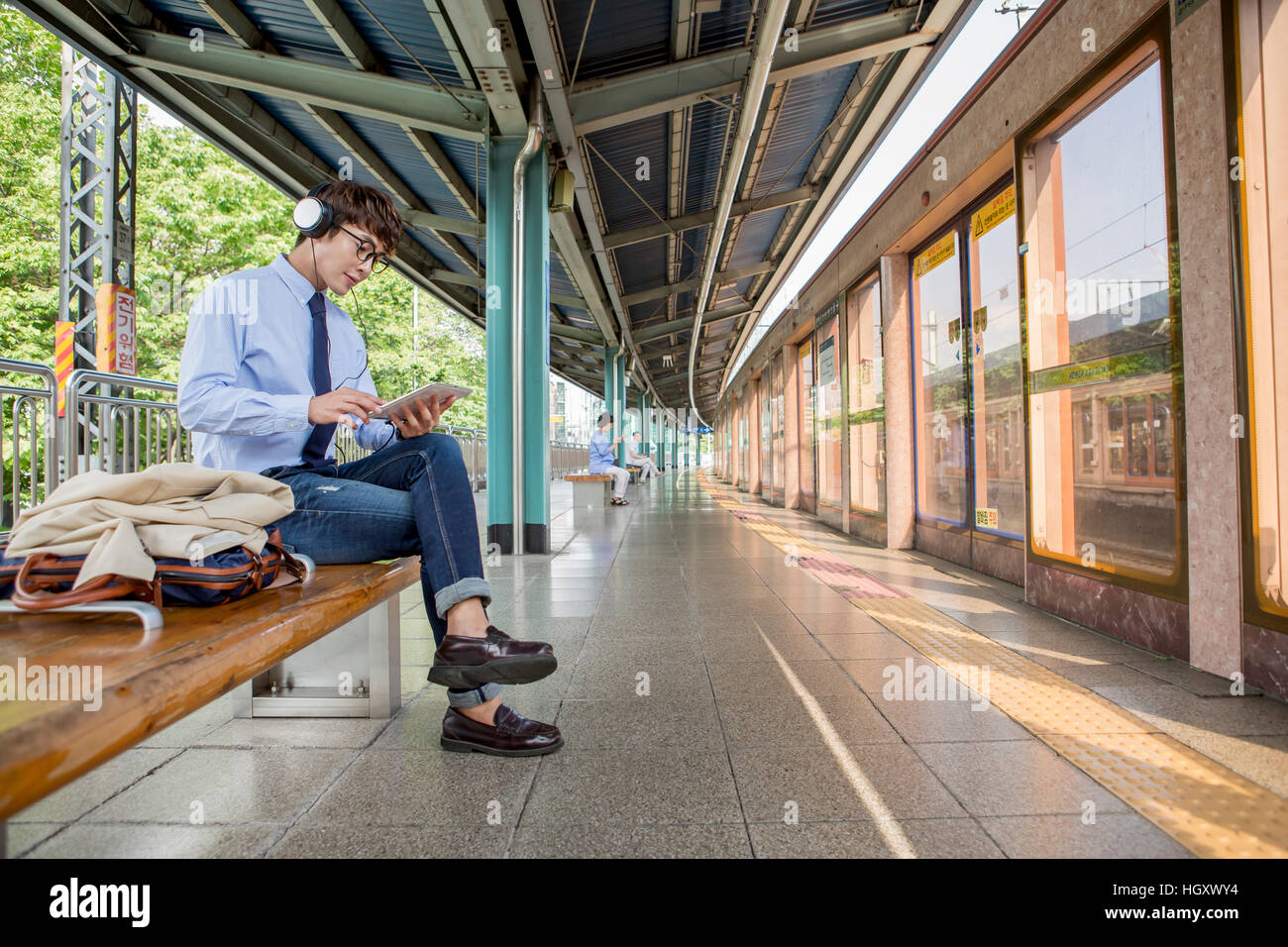 Train station with people using tablet hi-res stock photography and ...