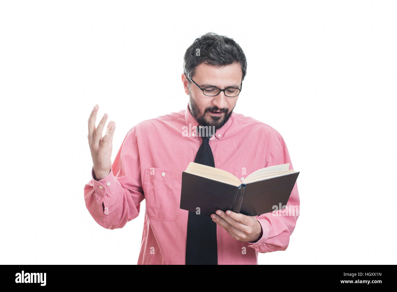 Young man reading a book and smiling Stock Photo - Alamy