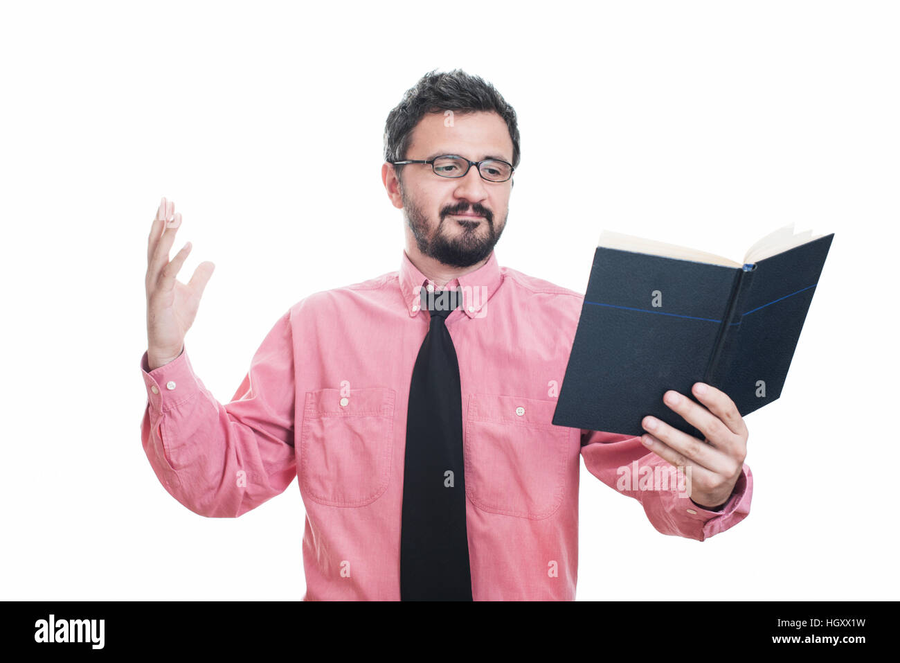 Surprised young man reading a book Stock Photo - Alamy