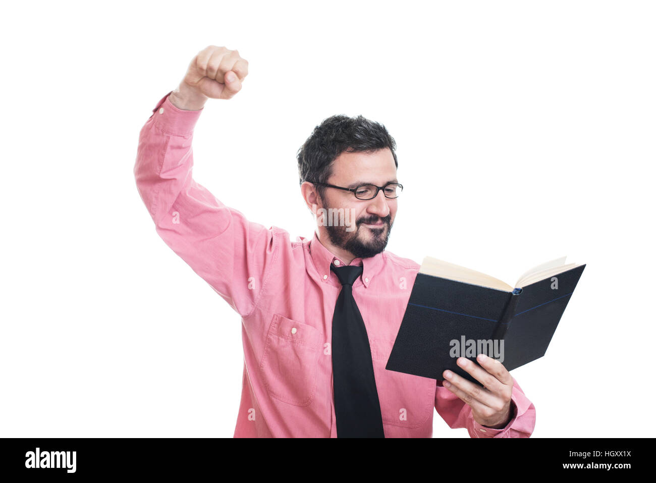 Young man reading a book and smiling Stock Photo - Alamy