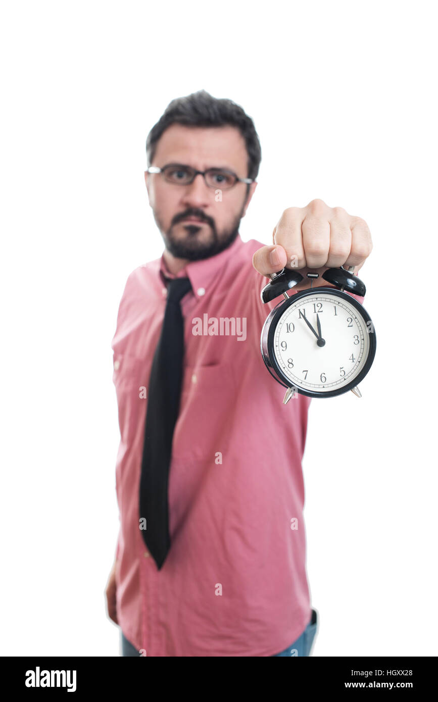 Young man showing an alarm clock Stock Photo - Alamy