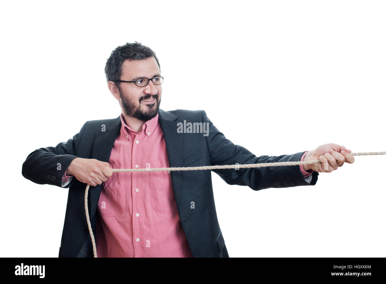 Man pulling a rope tug Stock Photo - Alamy