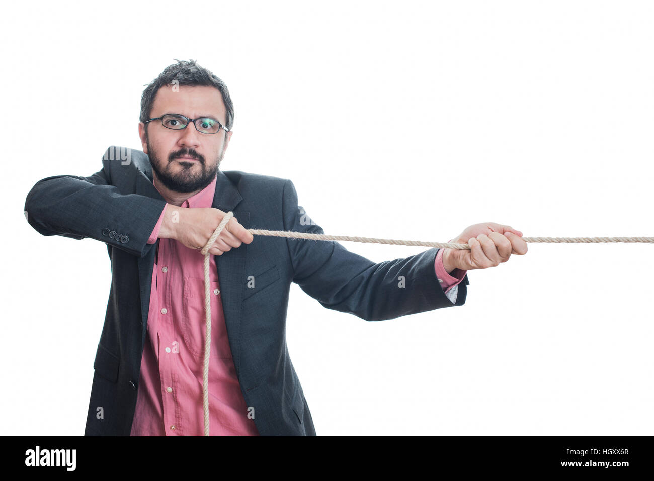 Man pulling a rope tug Stock Photo - Alamy