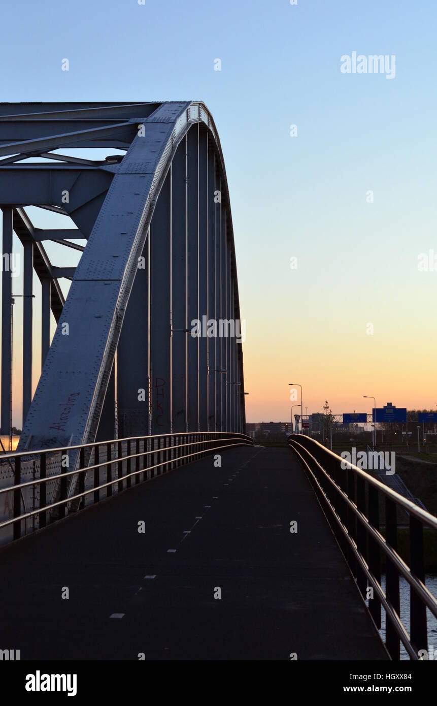 Cycle path on the Jutphasebrug, a steel arch bridge across the ...