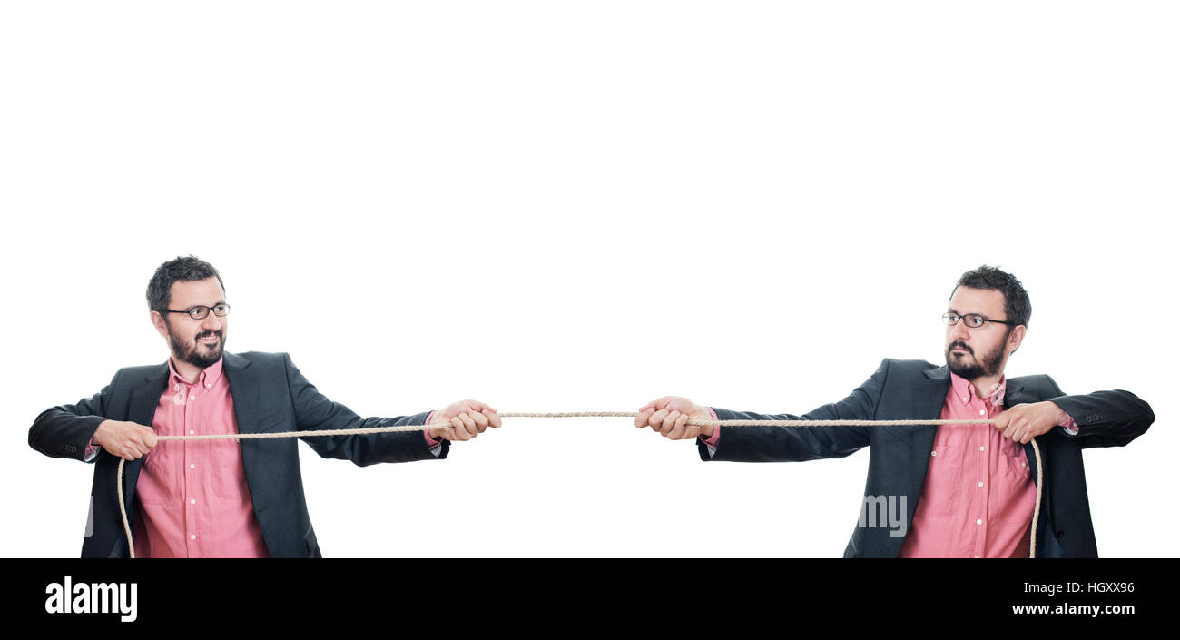 Two businessmen playing tug of war Stock Photo - Alamy