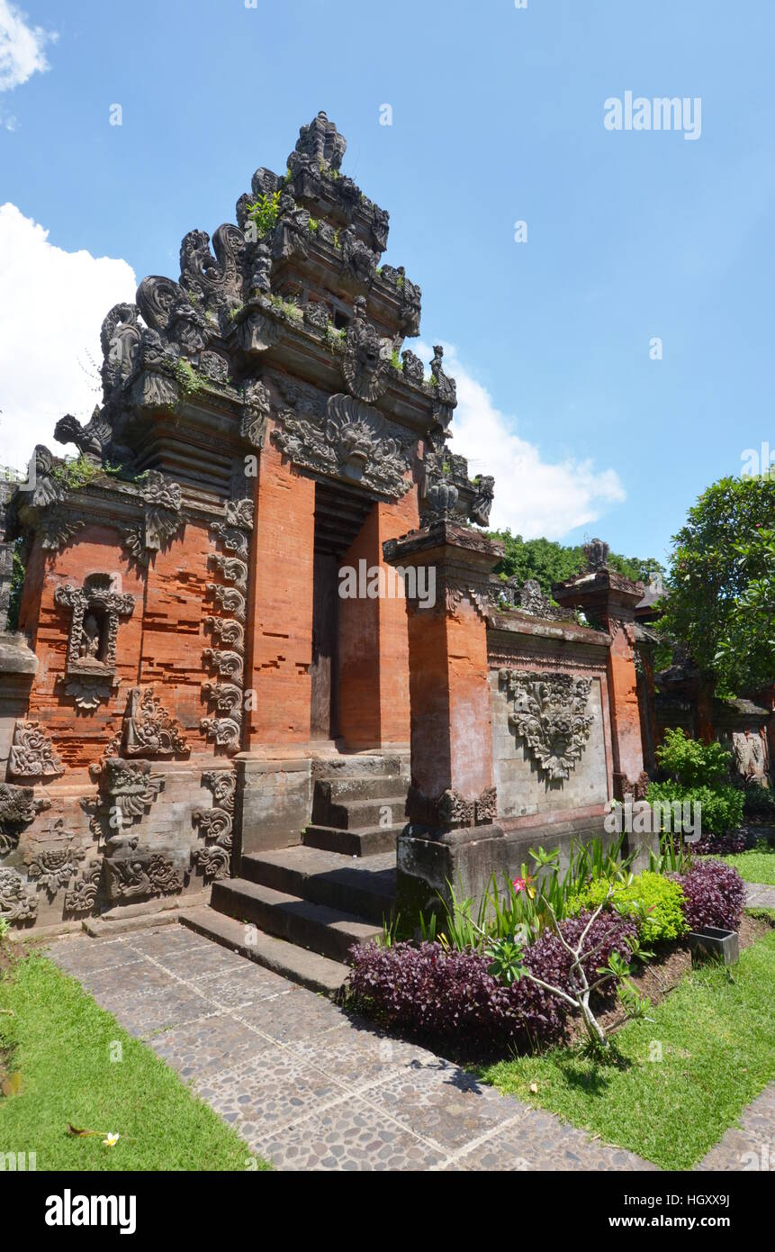 Red and grey stone decorated gateway in Bali Museum, Denpasar, Bali ...