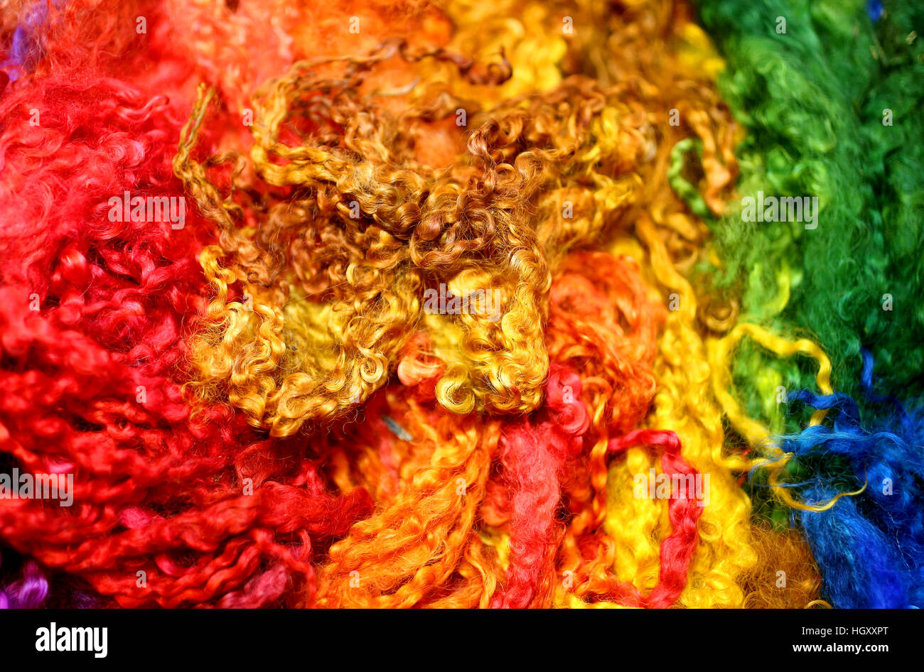 fantastic colorful background with soft wool strands and curls of a ...