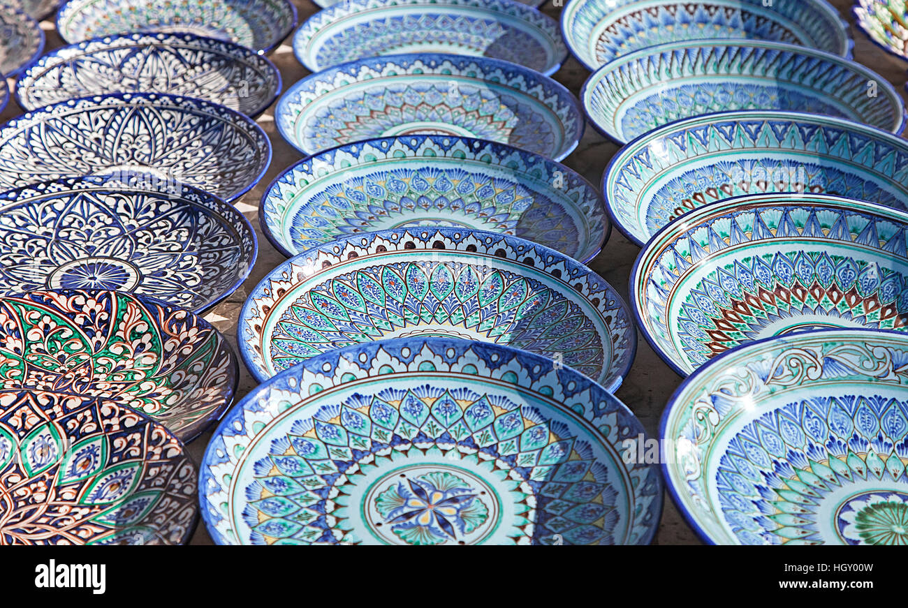 Traditional ceramic dishware in a street market, Uzbekistan Stock Photo ...