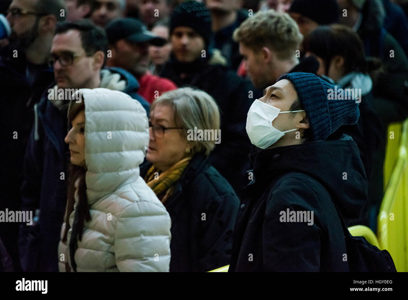 Masked queueing hi-res stock photography and images - Alamy