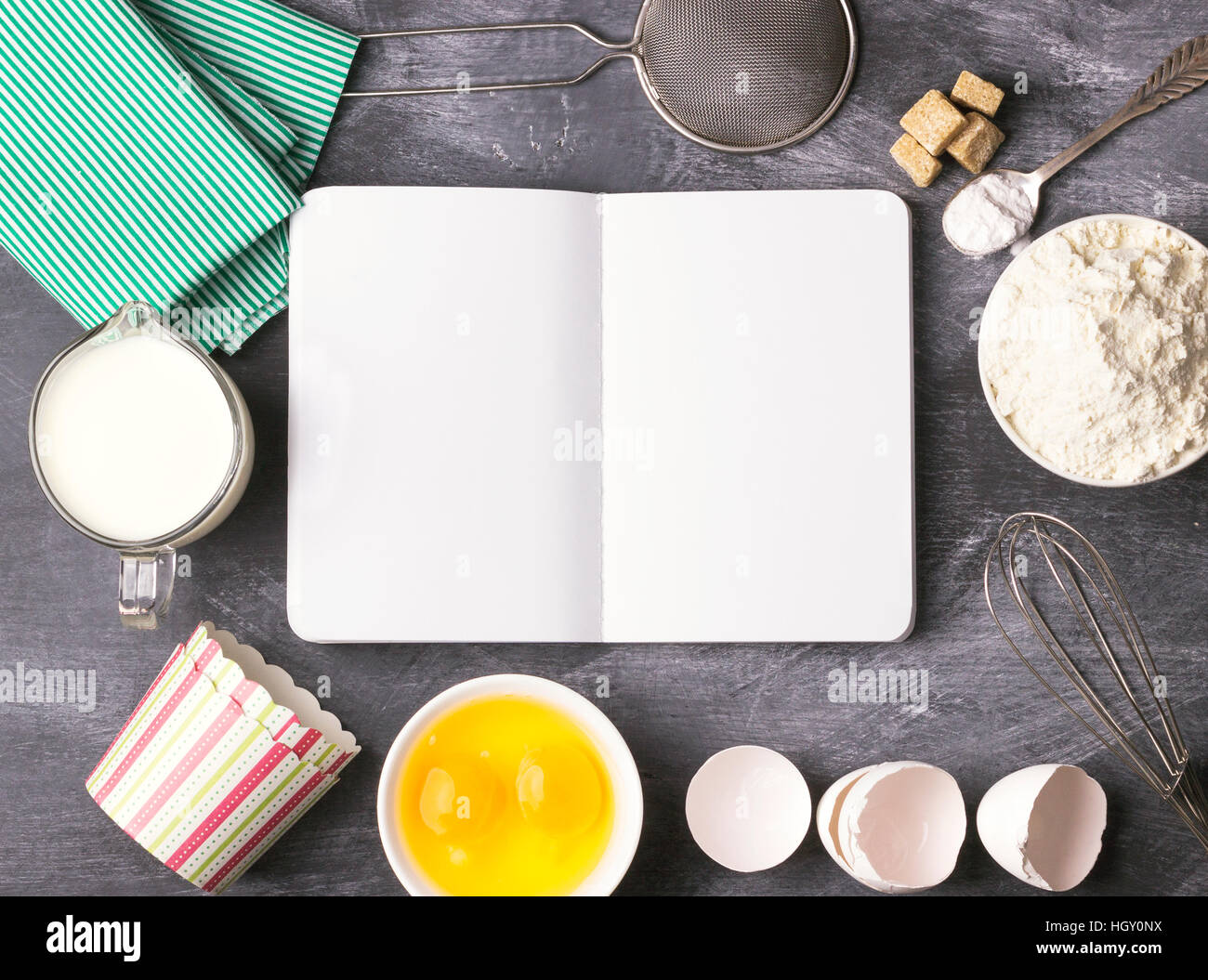Baking background with blank book, eggs, flour, milk. Free space for ...