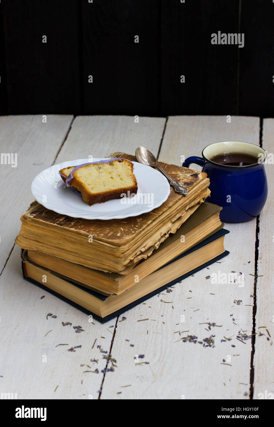 Cake slice on books Stock Photo - Alamy