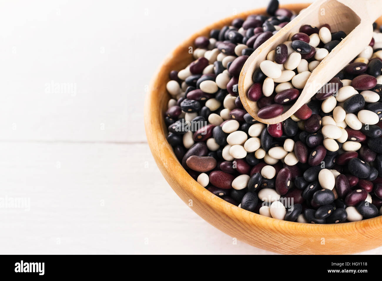 Various haricot in wooden bowl on white background Stock Photo - Alamy