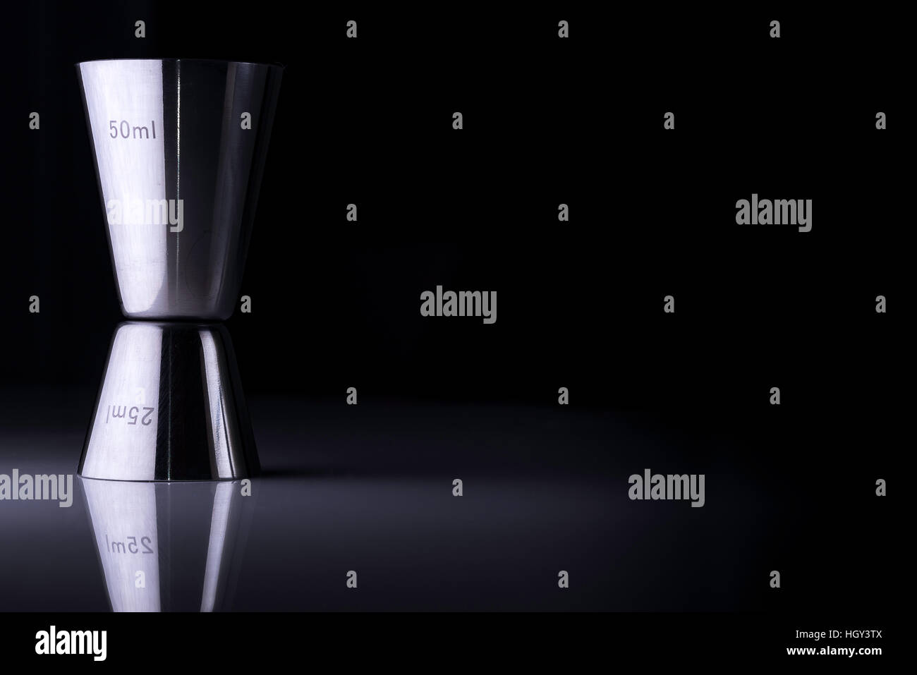 Cocktail Measure on black Stock Photo - Alamy
