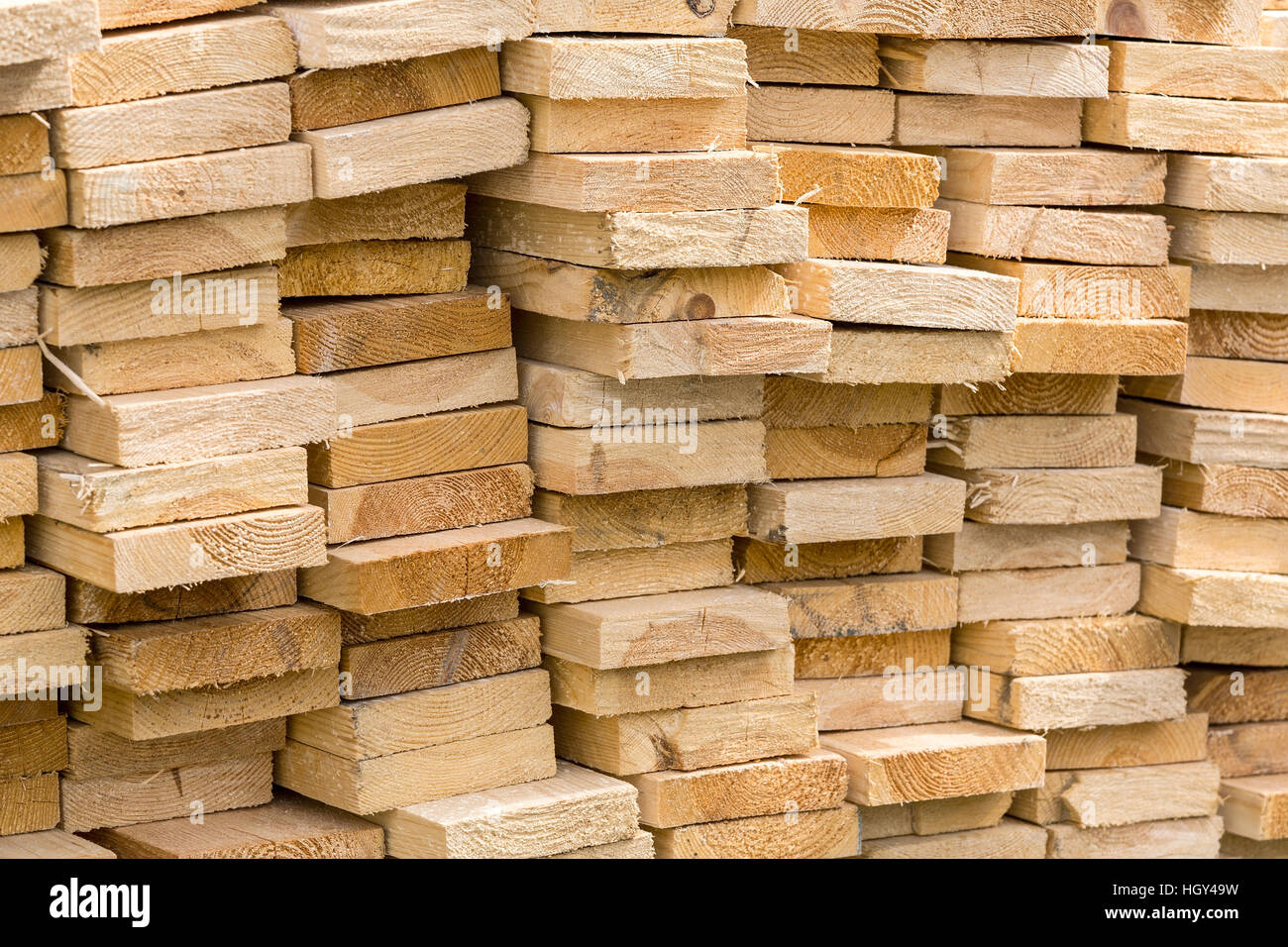 Stack of lumber at building site. Wood background series Stock Photo ...