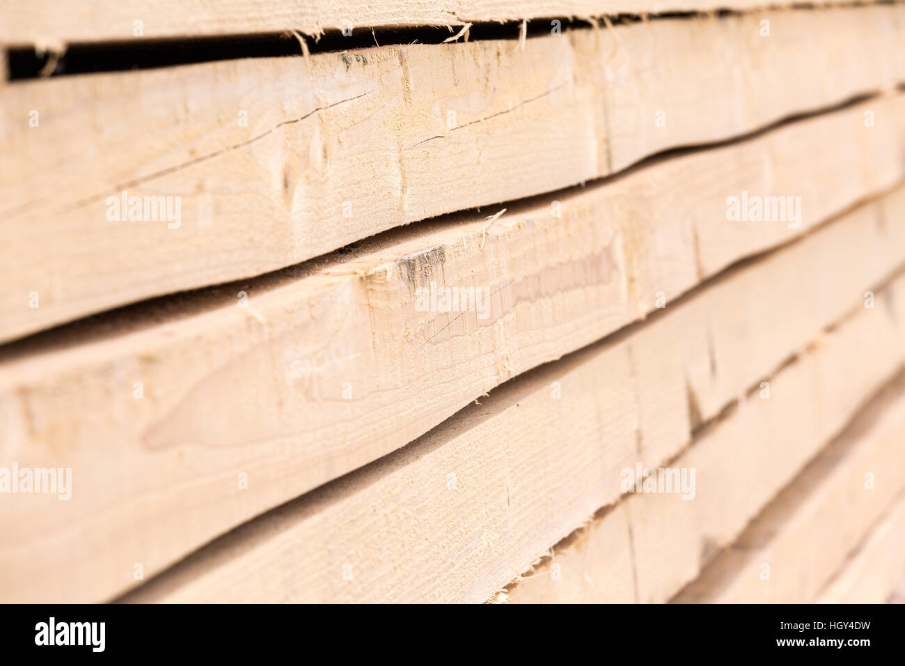 Stack of lumber at building site. Wood background series Stock Photo ...