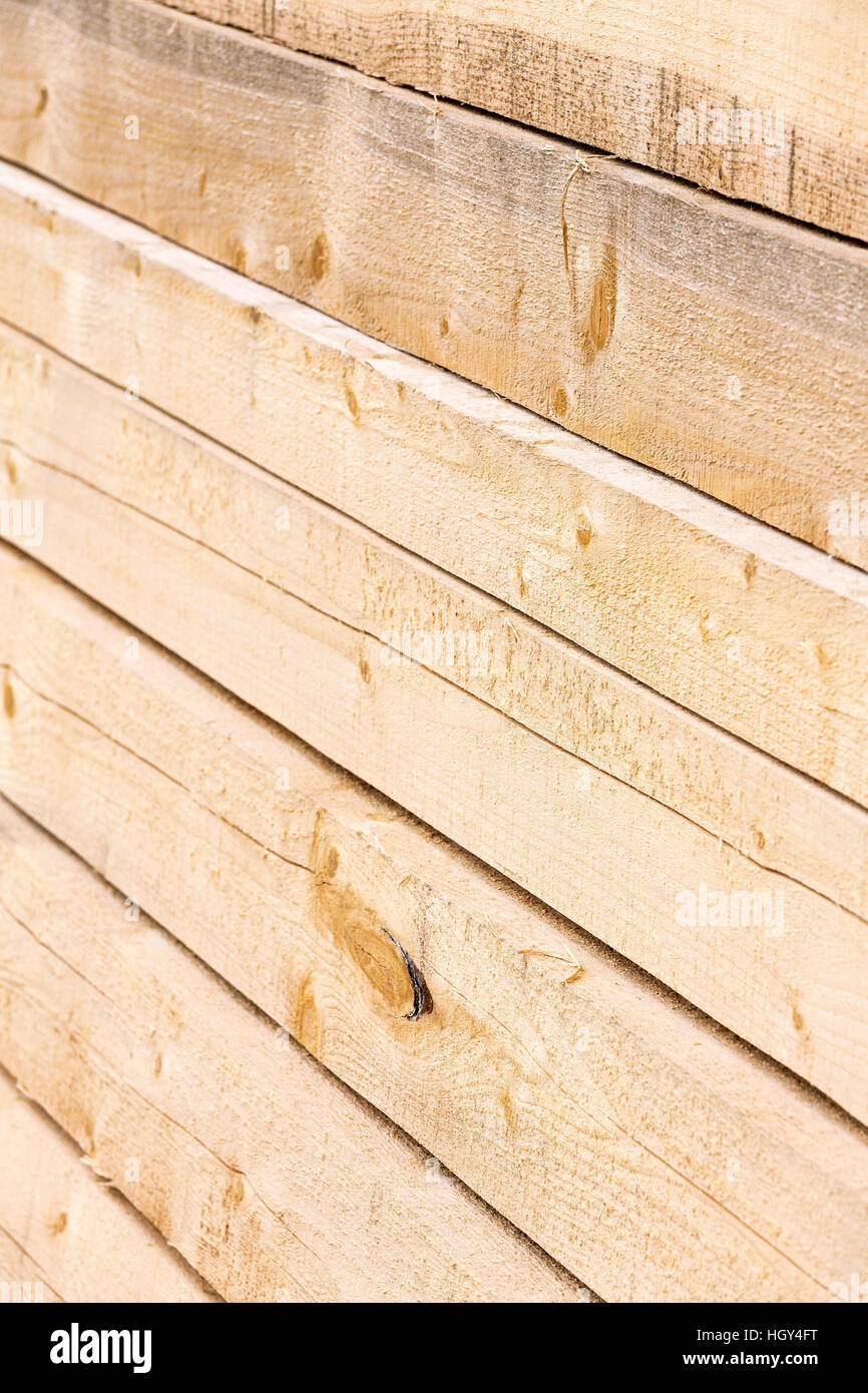 Stack of lumber at building site. Wood background series Stock Photo ...