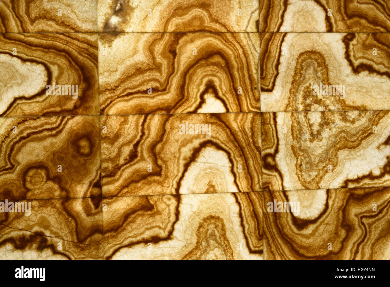 Backlit wall of polished beige onyx stone tiles Stock Photo - Alamy